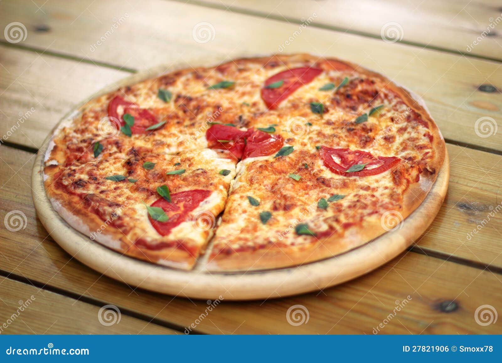 Pizza on a wooden plate stock photo. Image of wooden - 27821906