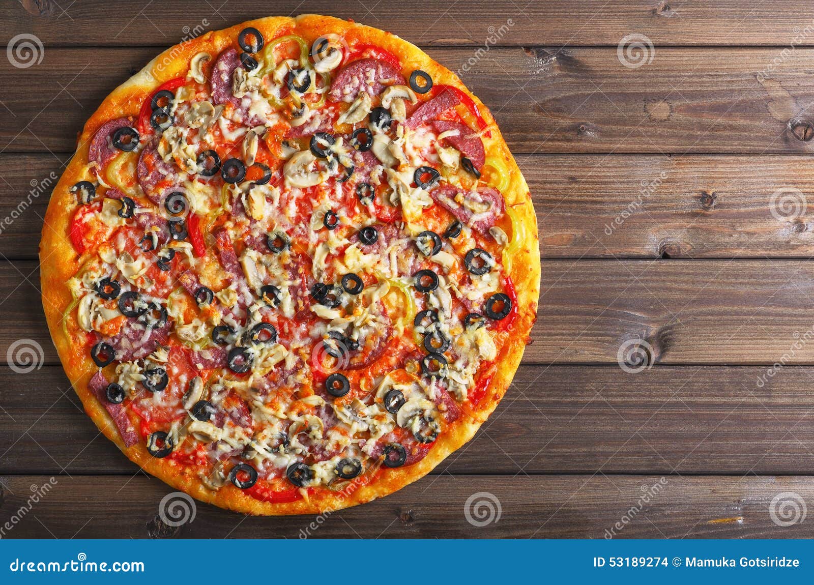 Pizza on a wooden table stock photo. Image of pepper - 53189274