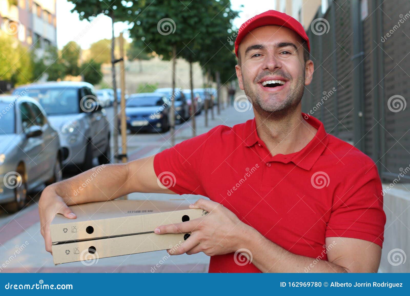 Pizza Worker Looking at Camera Stock Photo - Image of food, meal: 162969780