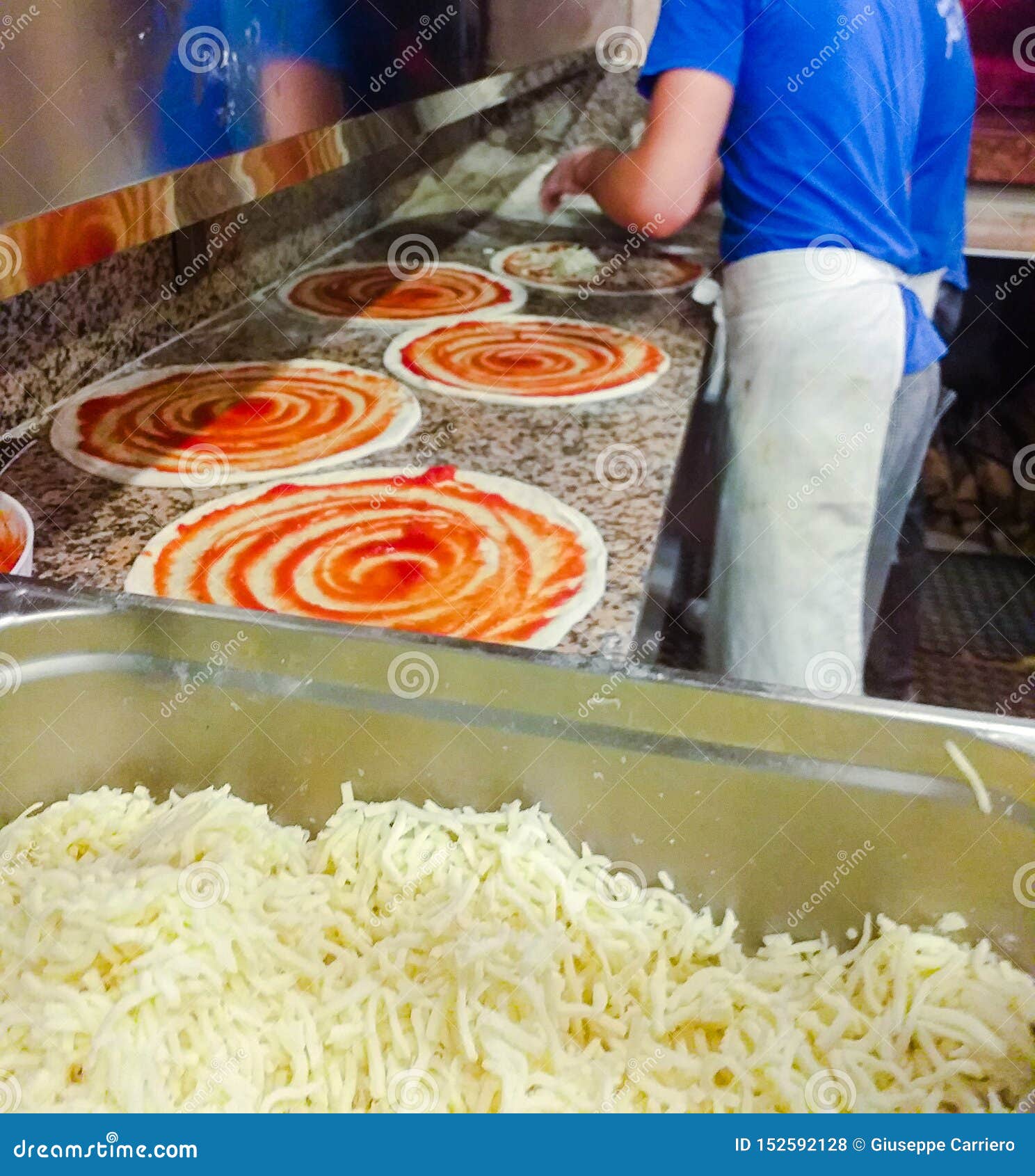 Pizzeria. Particular. Pizza Chef at Work while Creating His Wonderful ...