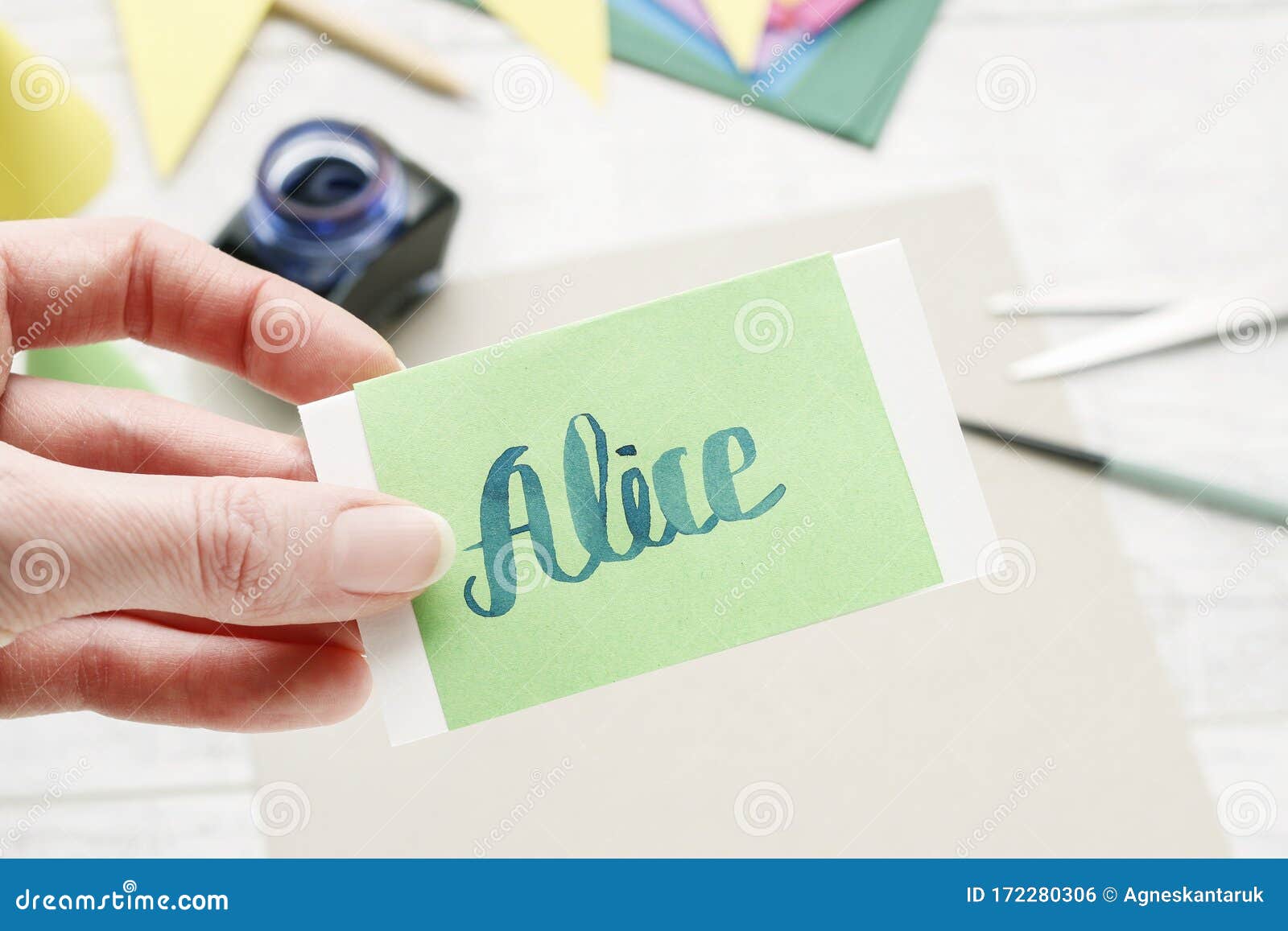 Place Card with Handwritten Name Stock Photo - Image of green, holding ...