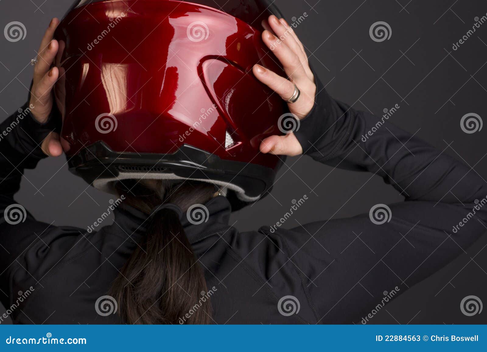 Woman Places Helmet on Her Head Rear View Stock Image - Image of tail ...