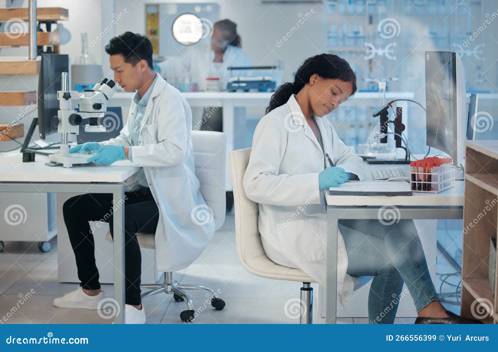 In a Place of Innovation. a Young Woman Making Notes while Working in a ...