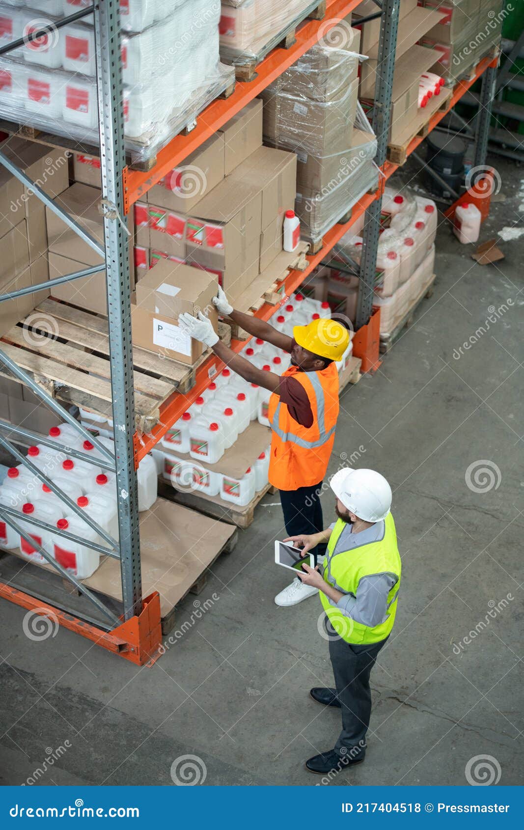Placing Box on Shelf Under Control of Manager Stock Photo - Image of ...