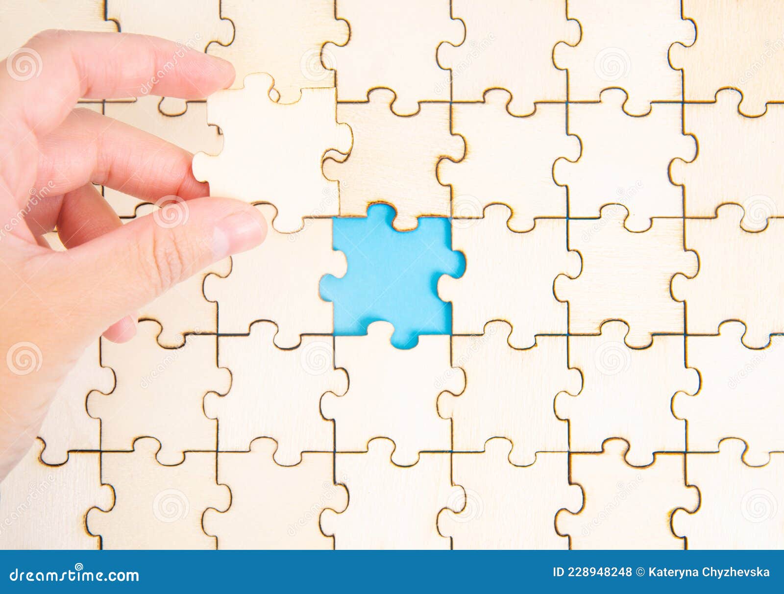 Placing the Final Piece of a Jigsaw Puzzle Stock Photo - Image of group ...