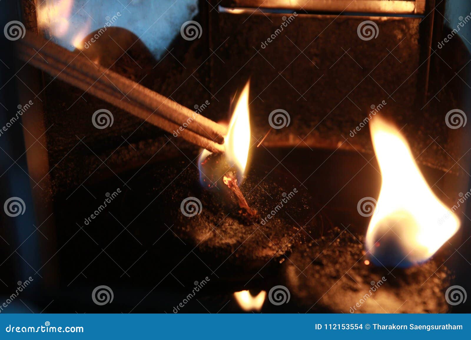 Placing the Lit Incense with Lamp Frame for Worship Buddha. Stock Photo ...