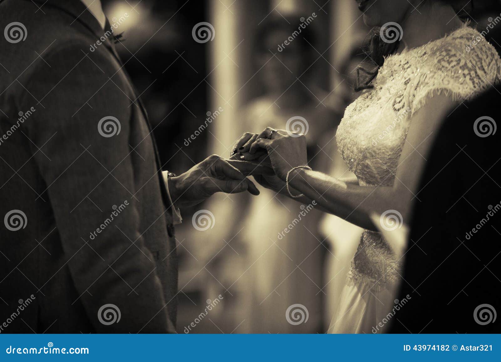 Placing Ring on Finger at a Wedding Stock Photo - Image of husband ...