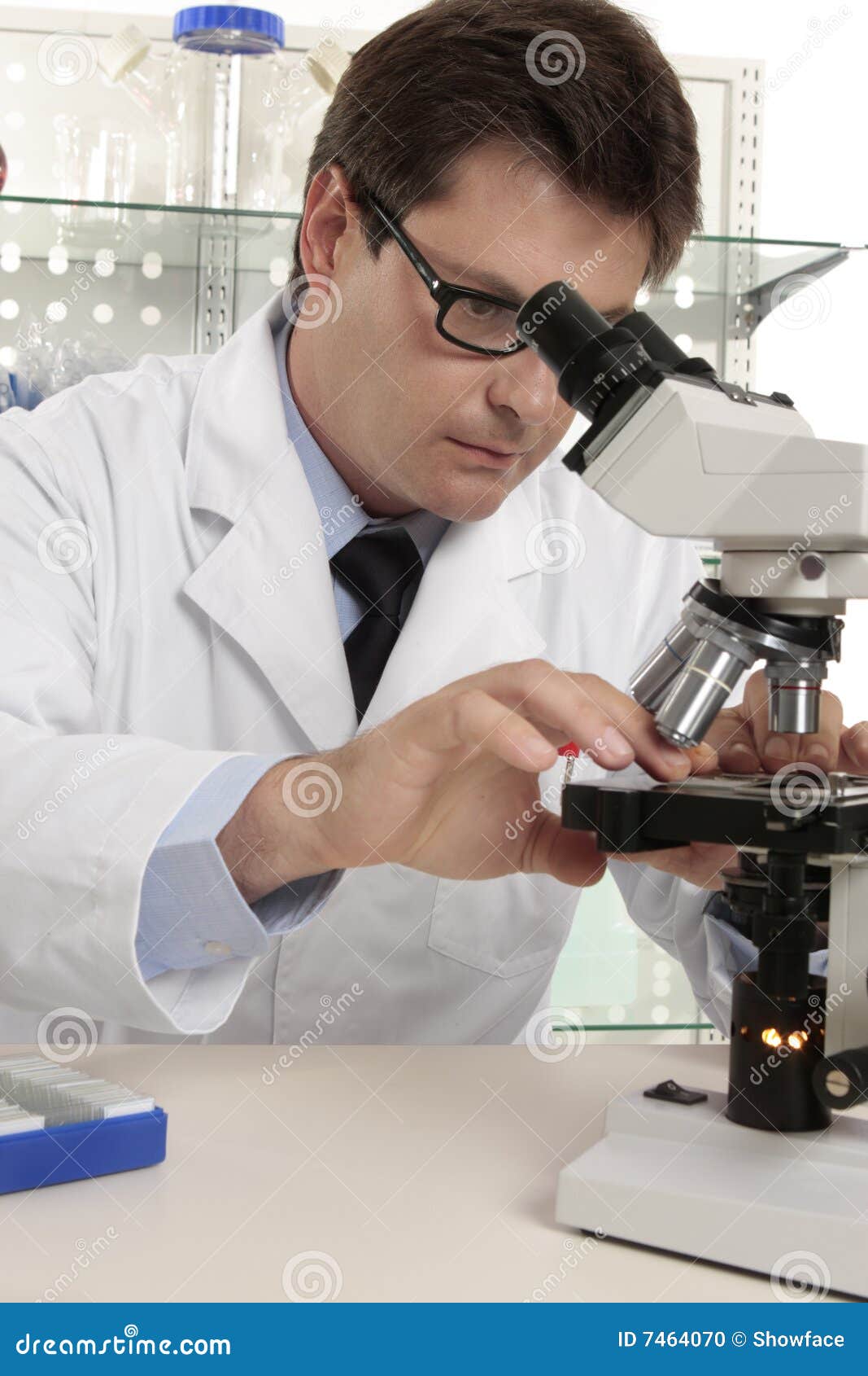 Placing Slide Under Microscope Stock Photo - Image of technician ...