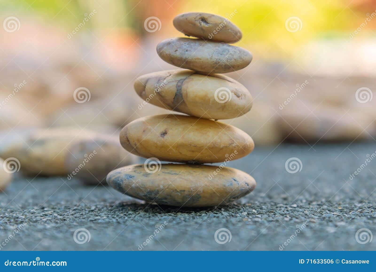 Placing the Stone Stack on a Rock Stock Photo - Image of green, rock ...