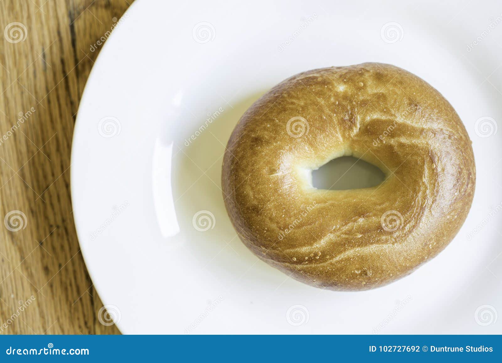 Plain Bagel Plate Wood Right Stock Photo - Image of golden, grain ...