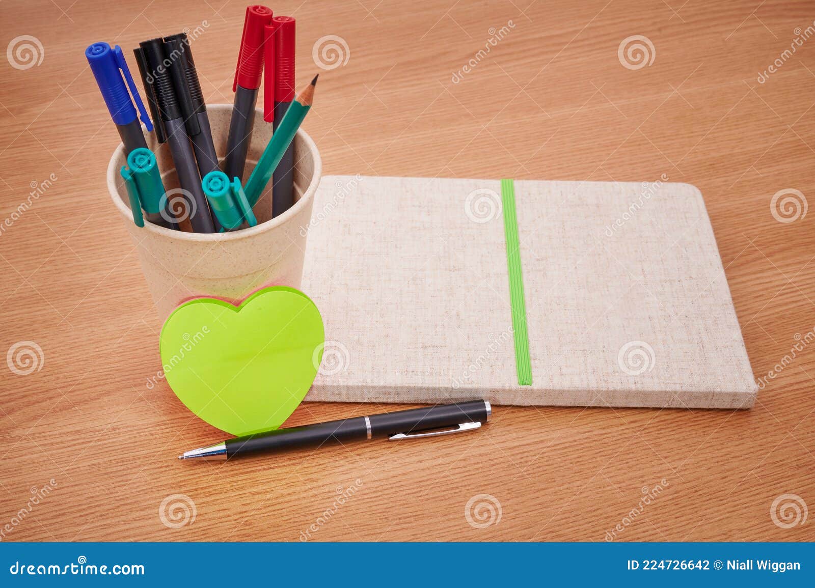 Plain Blank Open Notebooks with Stack of Pens Inside Container Placed ...