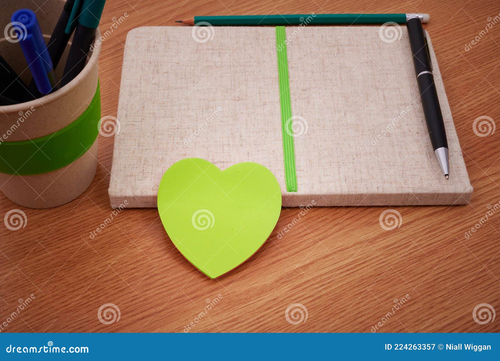 Plain Blank Open Notebooks with Stack of Pens Inside Container Placed ...