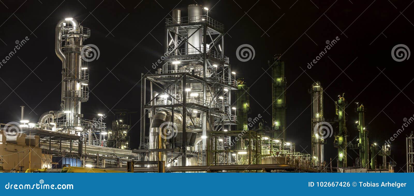 Plain refinery at night stock photo. Image of pipeline - 102667426