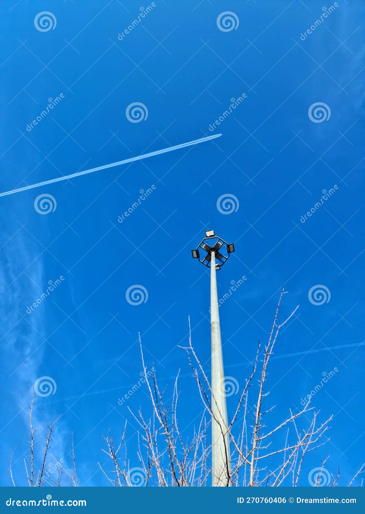 Plain, Light Pole, Tree and the Sky Stock Photo - Image of cloud, mast ...