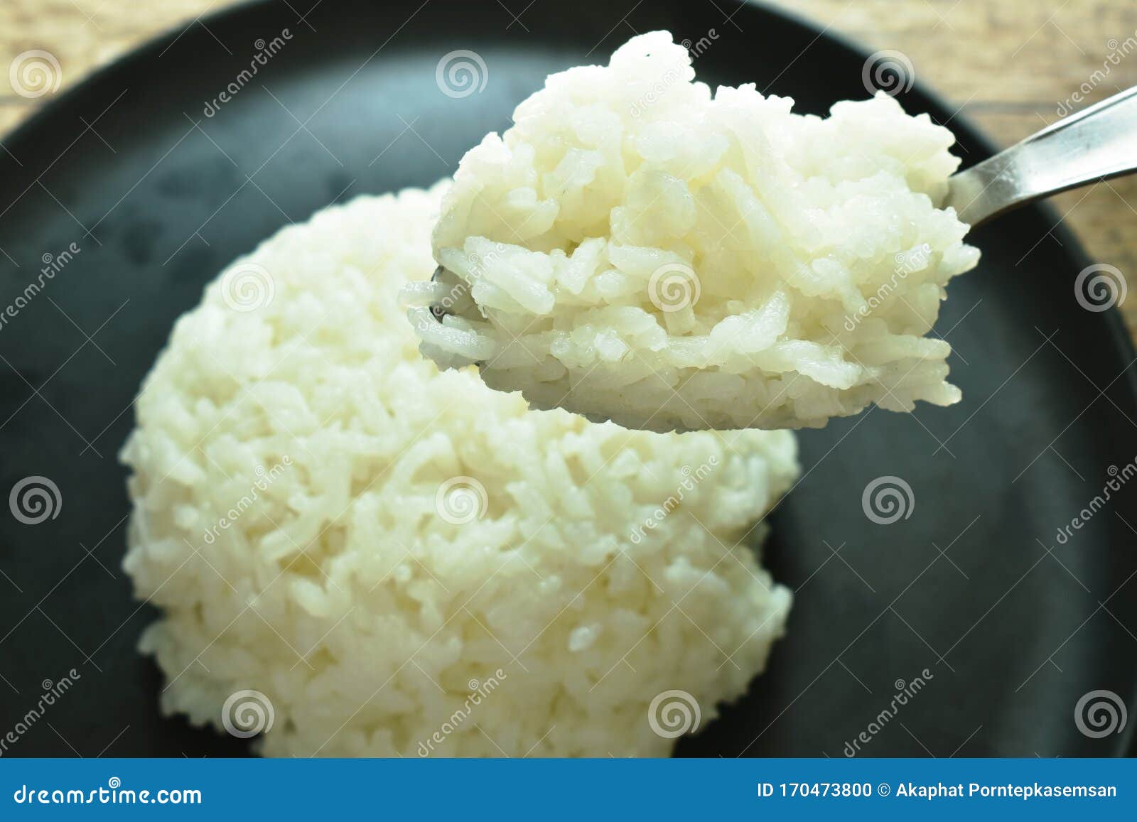 Plain Rice Scooping in Silver Spoon on Plate Stock Photo - Image of ...