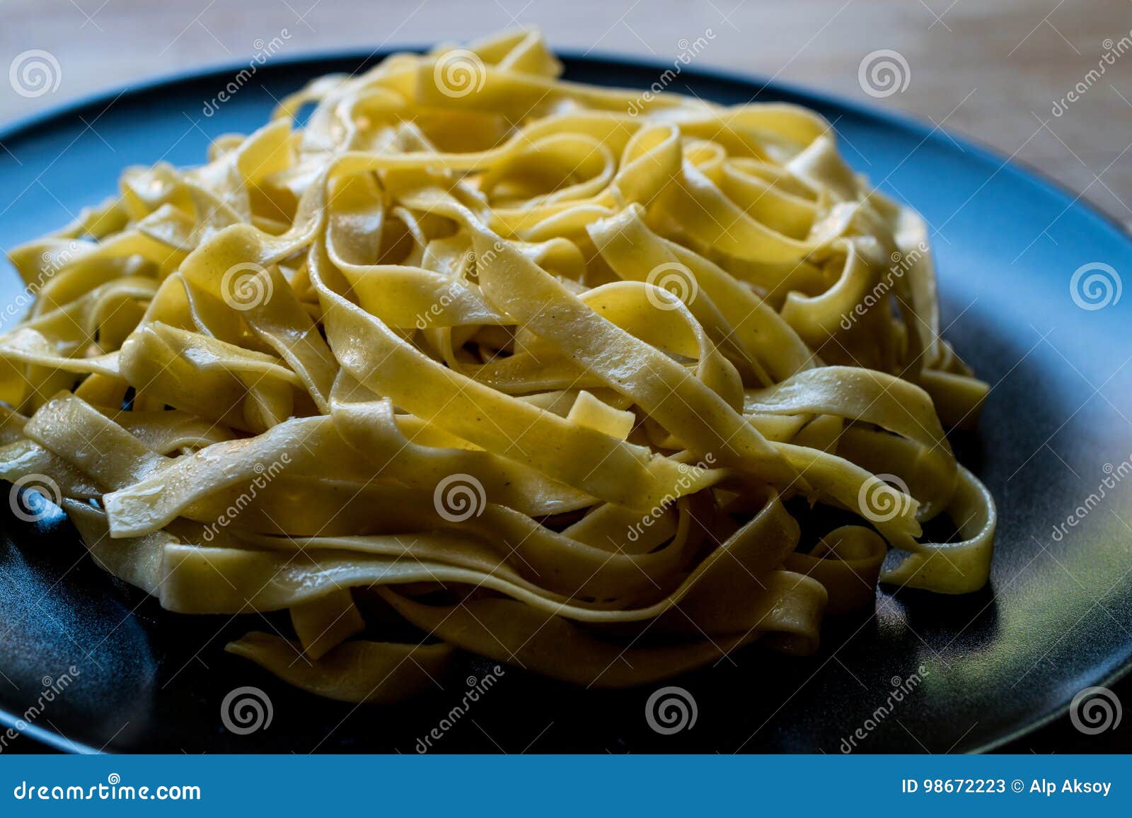 Plain Tagliatelle Pasta in Black Plate. Stock Image - Image of cheese ...