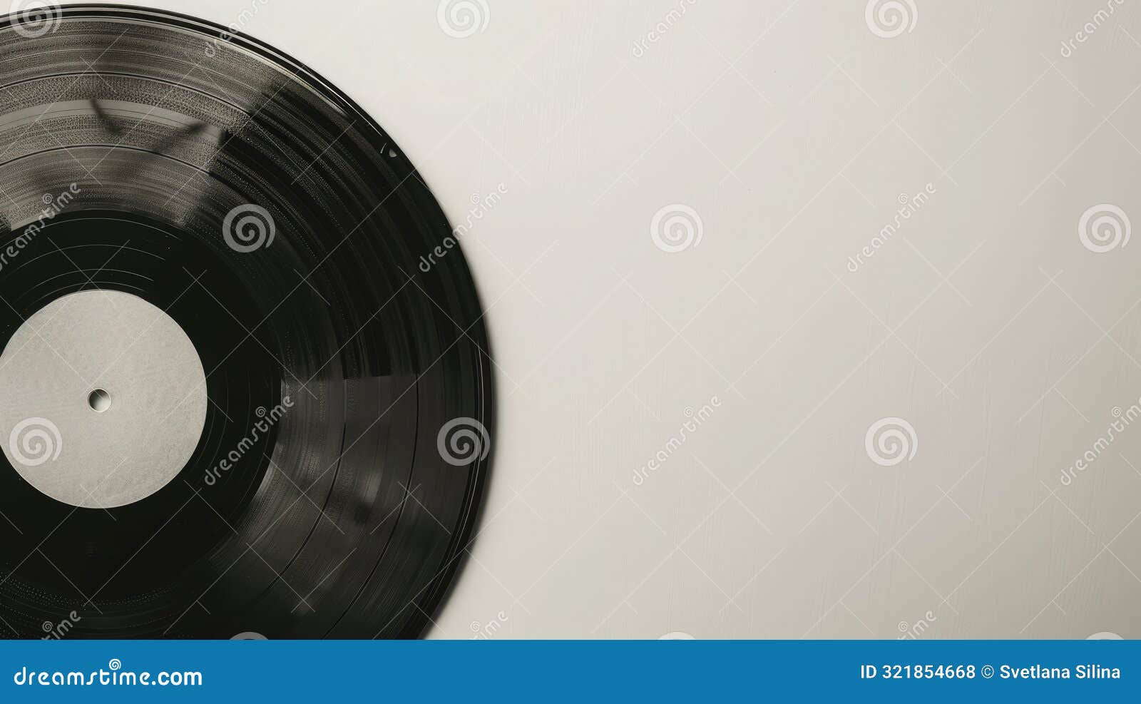 Plain White Background with an Old Vinyl Record Partially Emerging ...