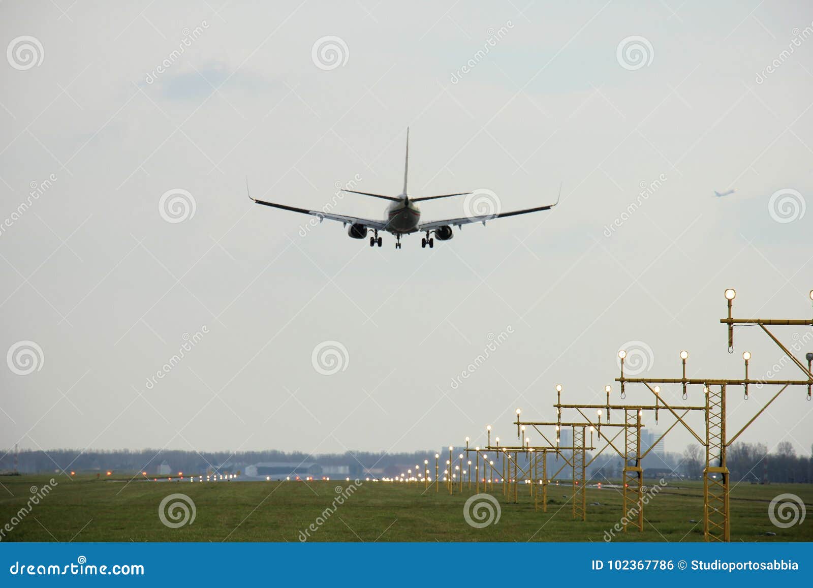 Plane approaching runway stock photo. Image of airlines - 102367786