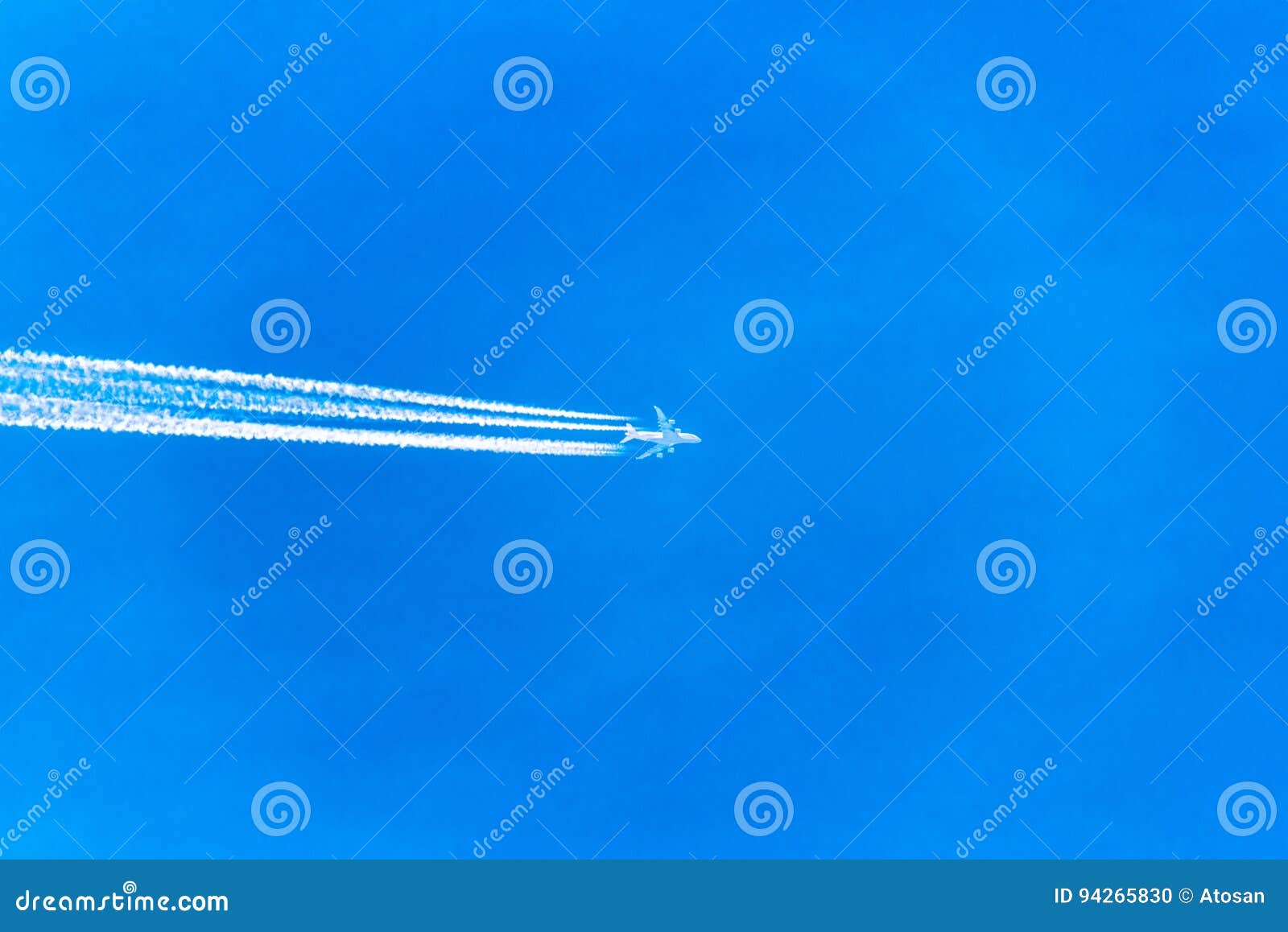 Plane at cruising altitude stock photo. Image of mountain - 94265830