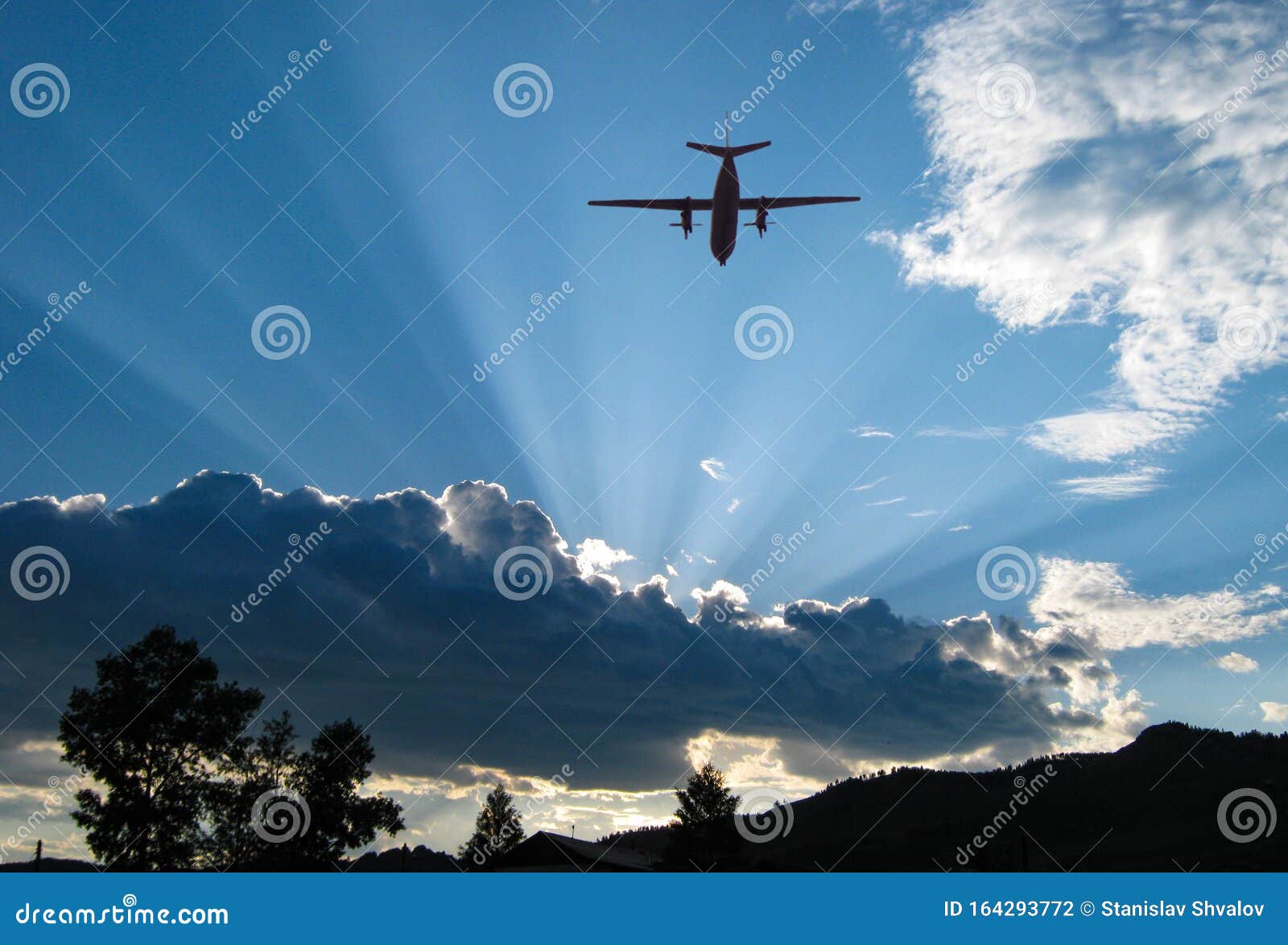 The Plane Flies Off into the Sunset. Stock Photo - Image of jetliner ...