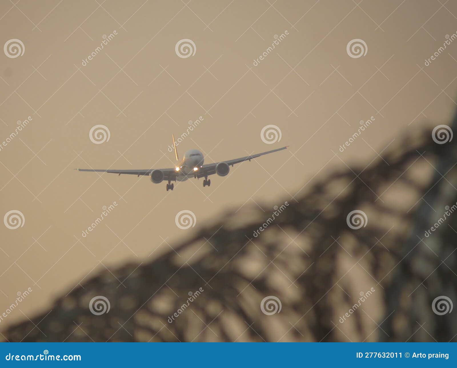 The Plane Flies Over the Airport Guardrail Stock Image - Image of ...