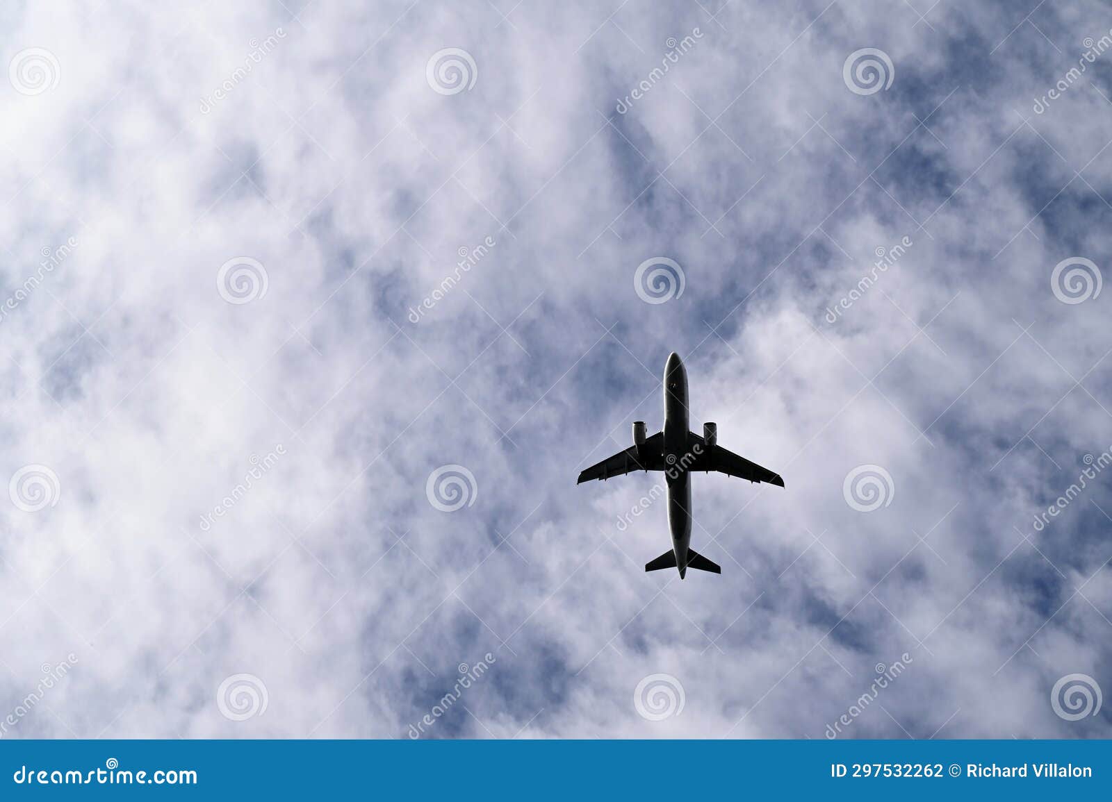 Plane in Flight Seen from Below Stock Photo - Image of charter, flight ...
