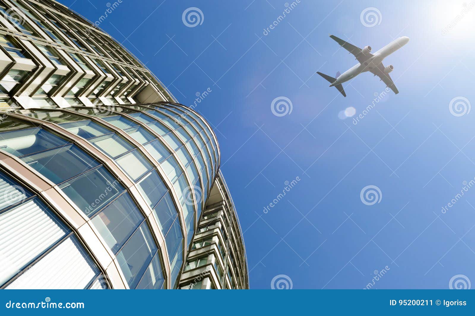 Plane Flying Above Modern Office Building. Stock Image - Image of plane ...
