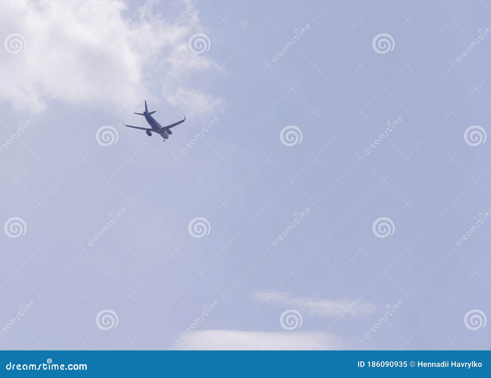 Plane Flying Away into the Distance Against a Blue Sky Stock Image ...