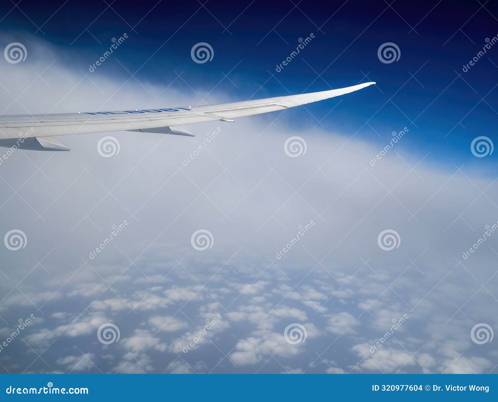 Plane Flying between Cloud Layers Viewed from Passenger Cabin Window Stock Photo - Image of ...