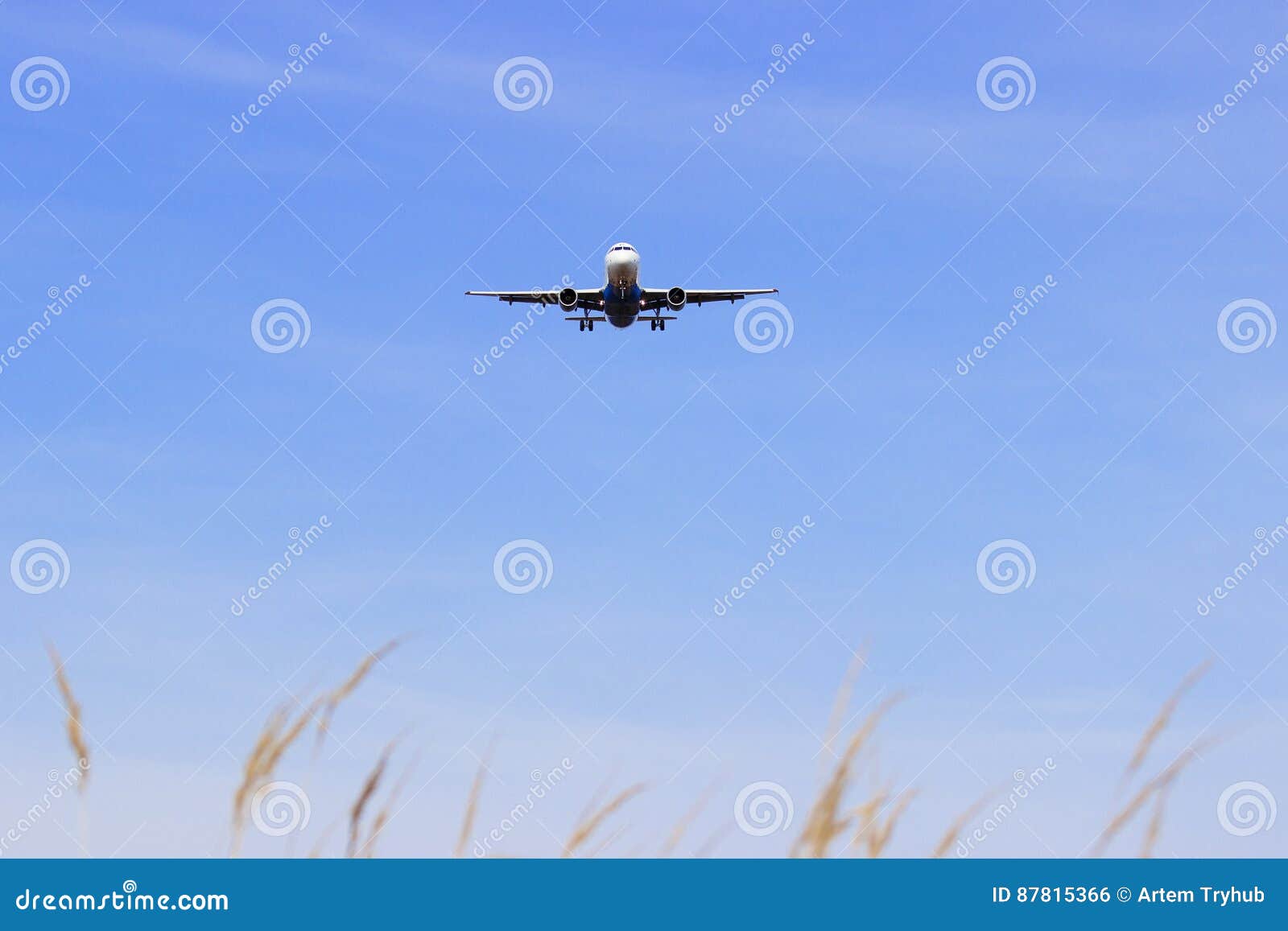 Plane Flying through Clouds in the Sky. Jet Aircraft. Stock Photo ...