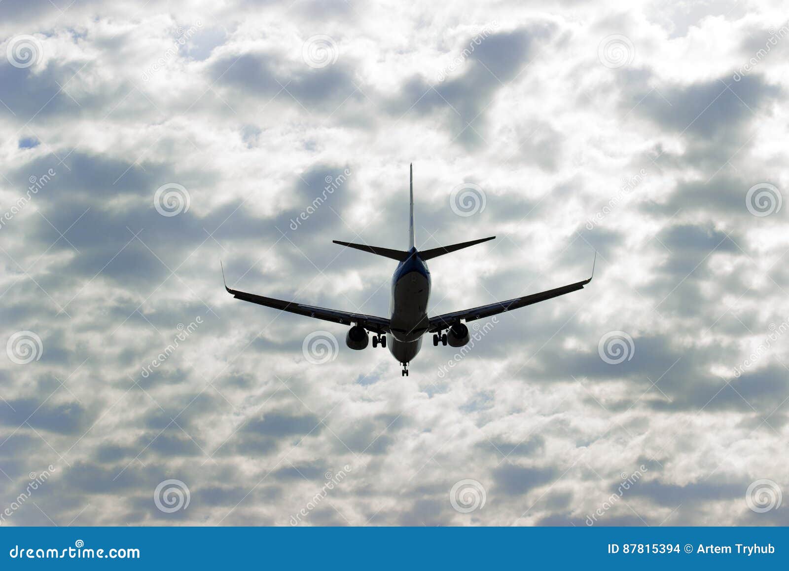 Plane Flying through Clouds in the Sky. Jet Aircraft. Stock Photo ...