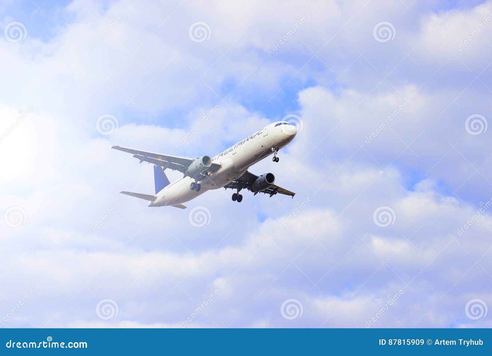 Plane Flying through Clouds in the Sky. Jet Aircraft. Editorial Stock ...