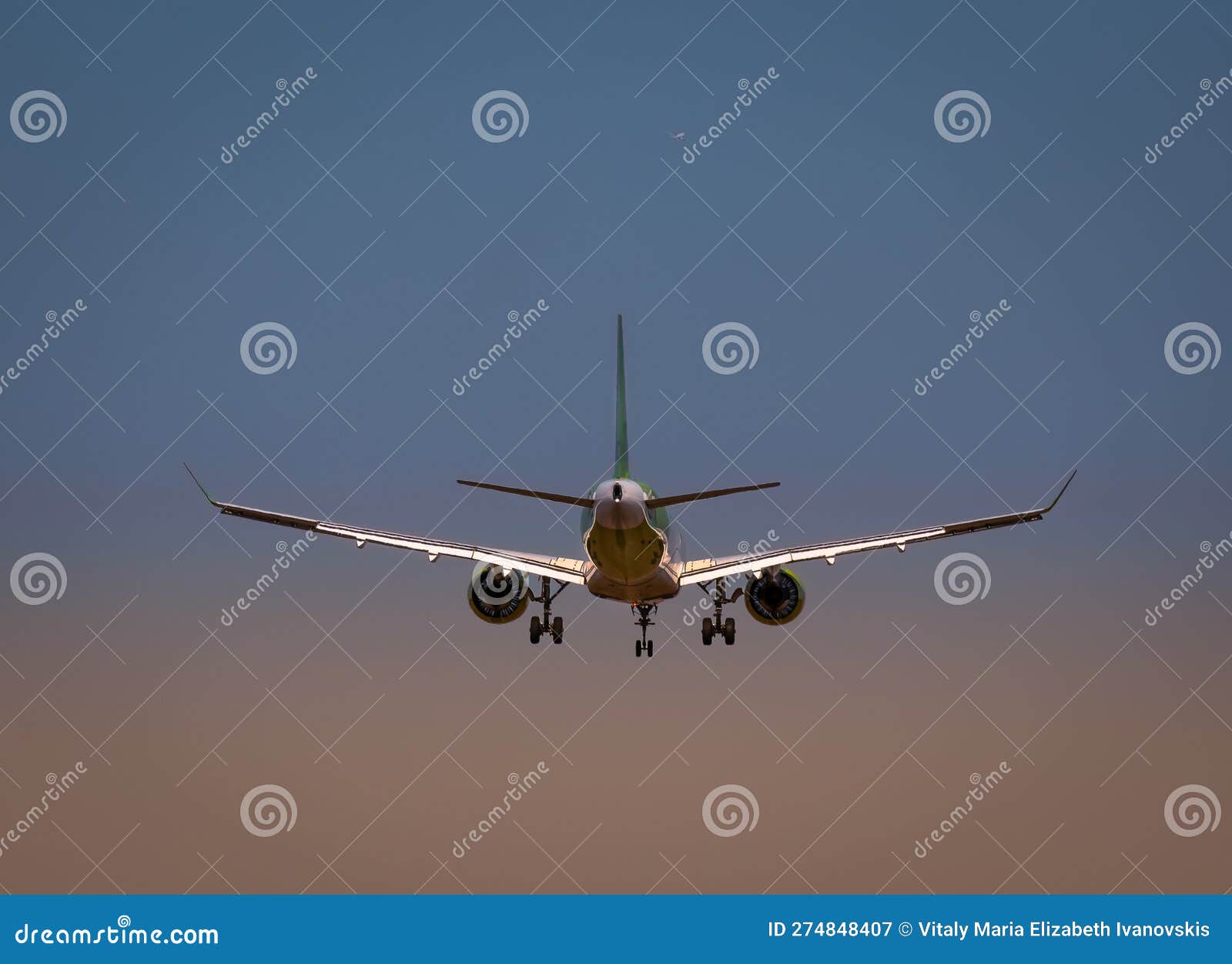 A Plane Flying into the Distance, into the Evening Sky, a View from the ...