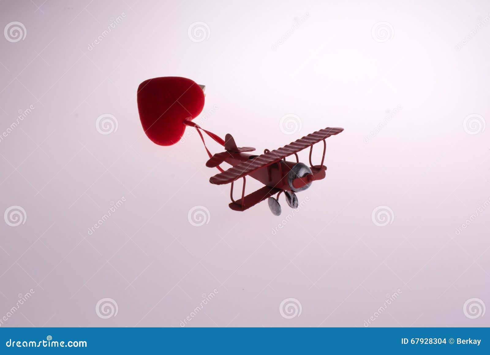 Plane flying a heart stock photo. Image of carry, happy - 67928304