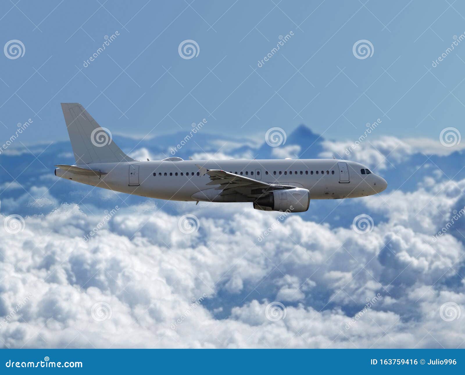 Plane Flying at High Altitude Above the Clouds Stock Photo - Image of ...