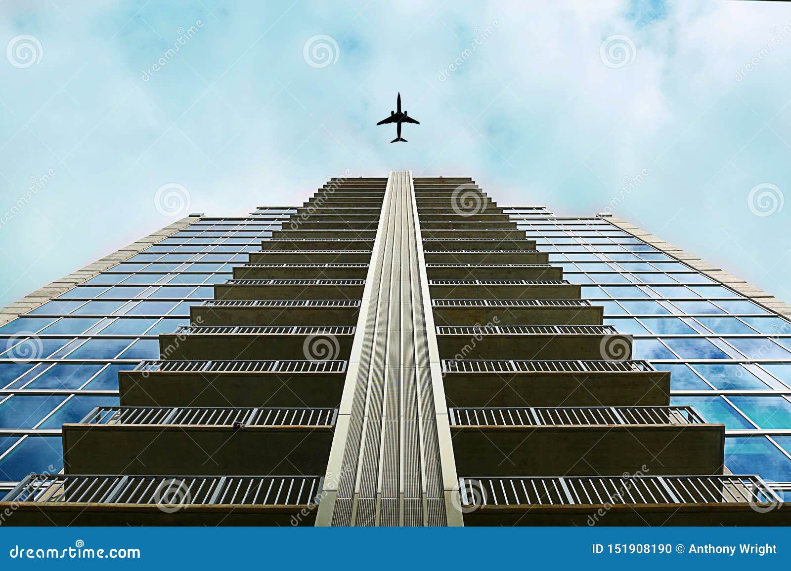 Plane Flying Over a Building Stock Photo - Image of building, city ...