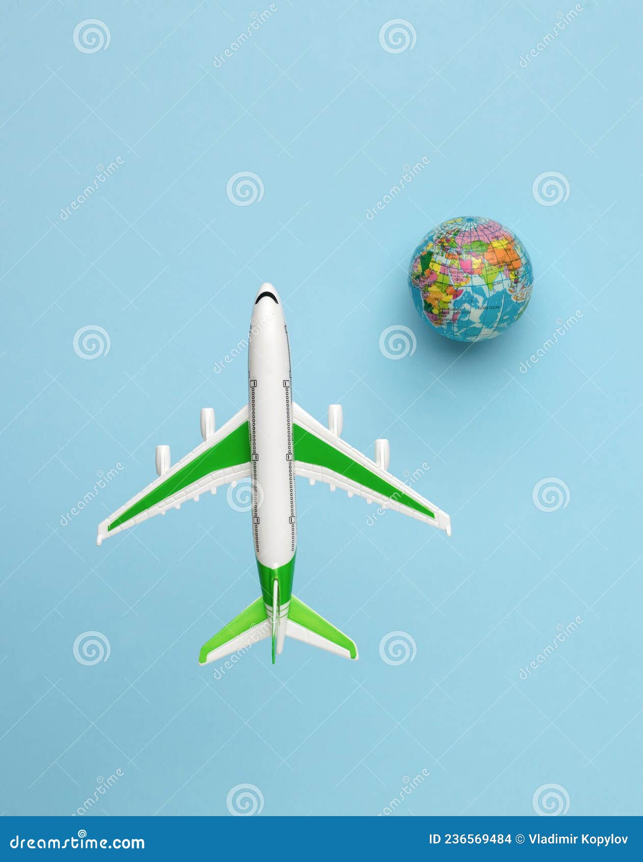 A Plane Flying Over the Globe on a Blue Background. Flat Lay Stock ...