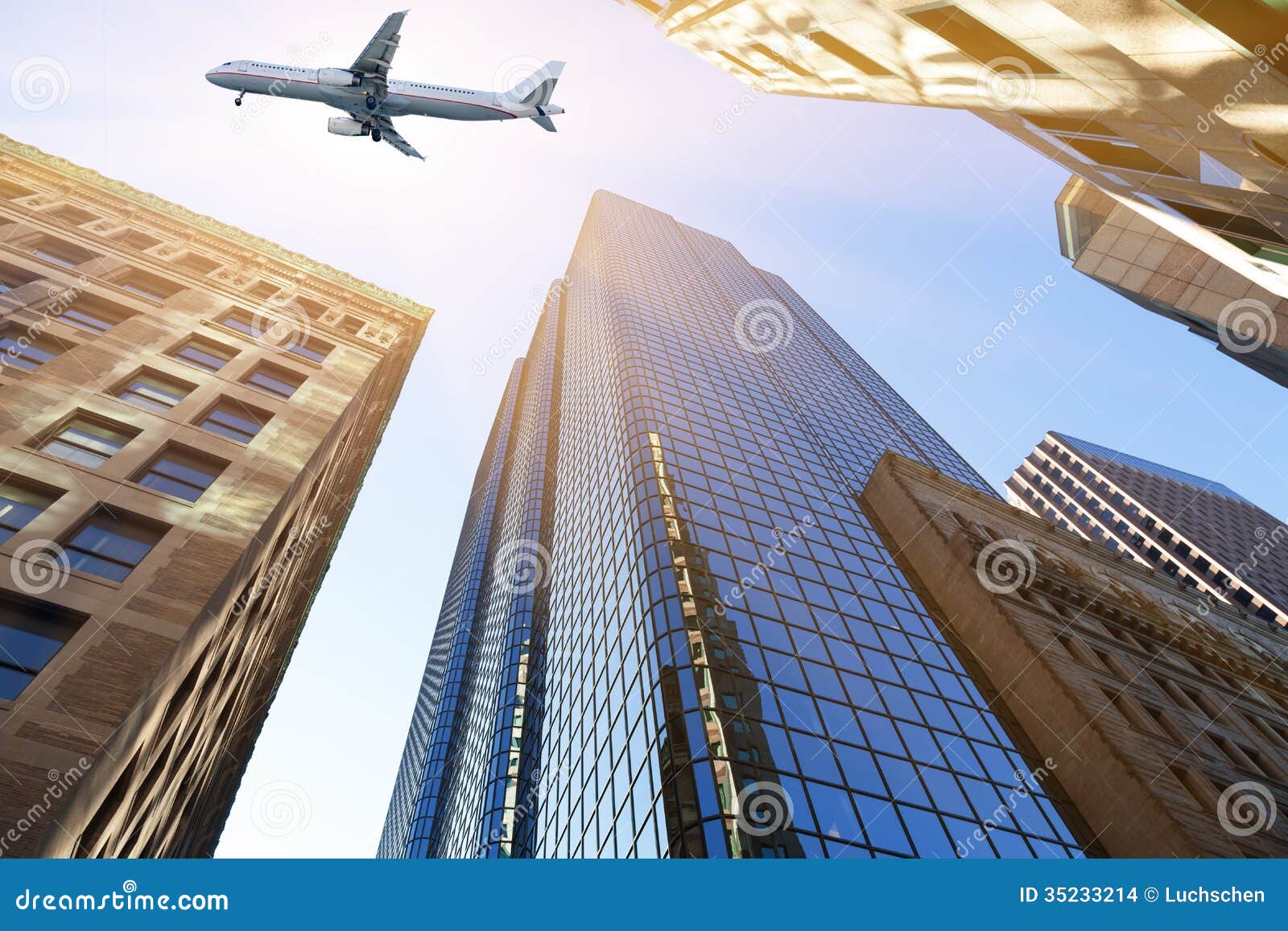 Plane Flying Over Skyscrapers Stock Photo - Image of blue, aircraft ...