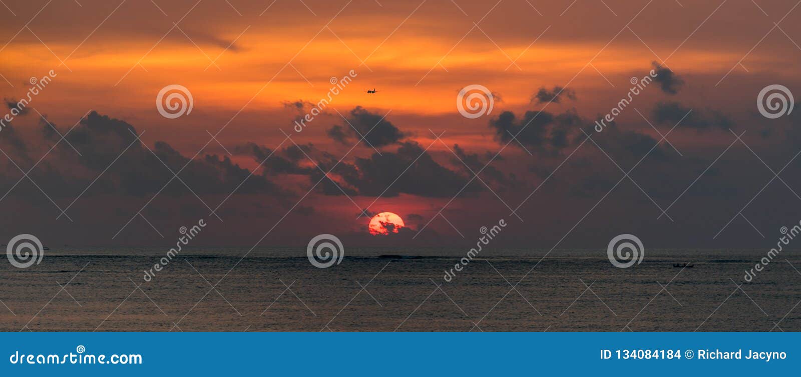 Plane Flying Over the Sun in a Bali Sunset Stock Photo - Image of ...
