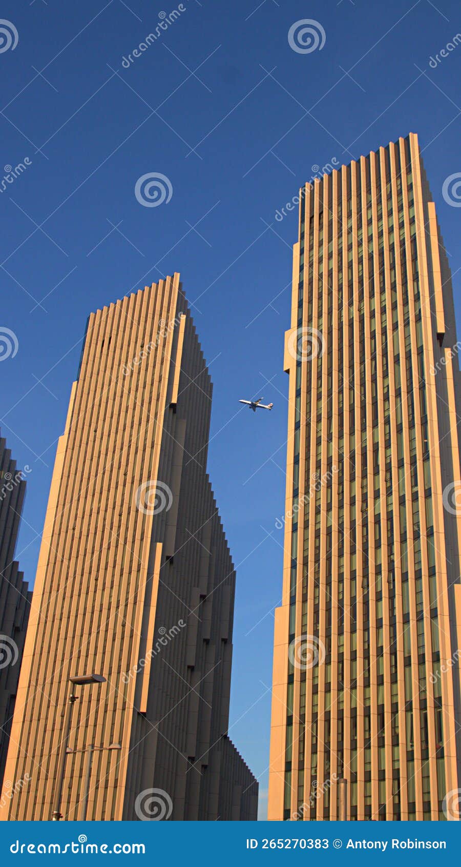 Plane Flying between Two Modern Buildings Stock Image - Image of living ...
