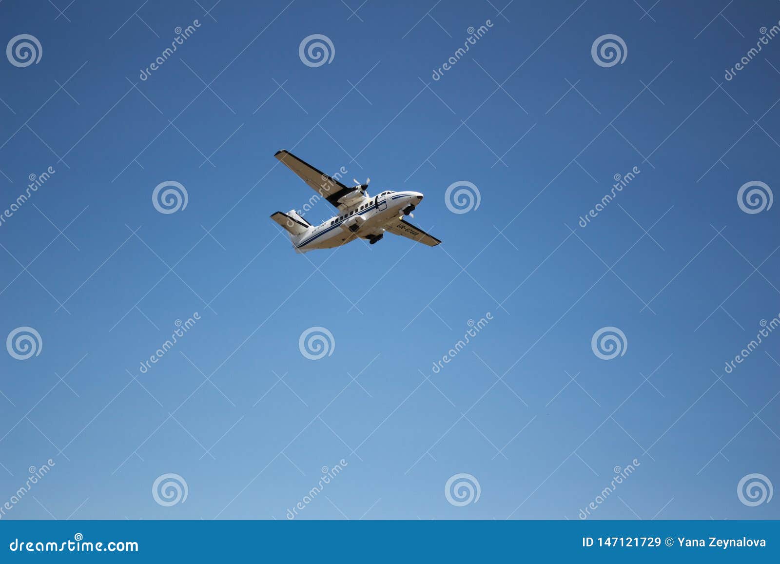 The Plane Hovering in the Blue Sky. Editorial Stock Image - Image of ...