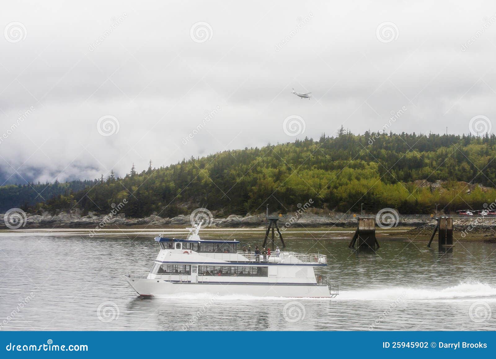 Plane Landing Over Ferry in Alaska Stock Photo - Image of plane ...