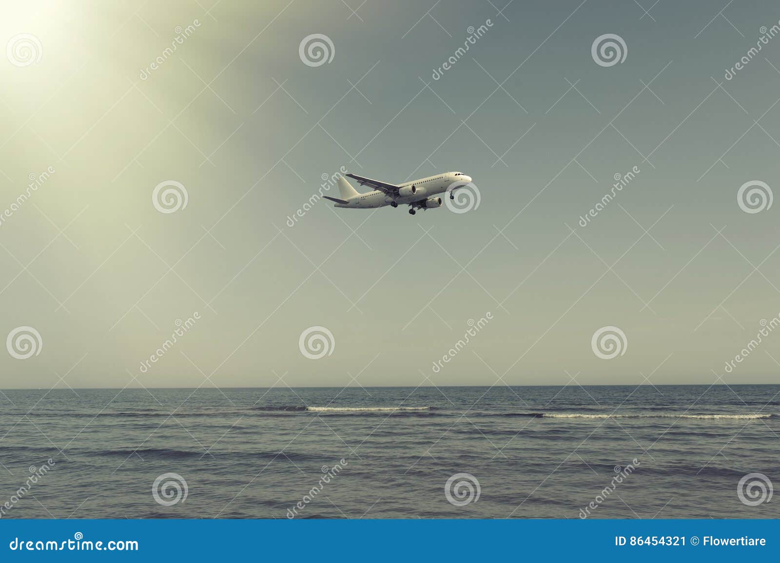 The Plane Landing Over the Sea in Cyprus Stock Image - Image of water ...