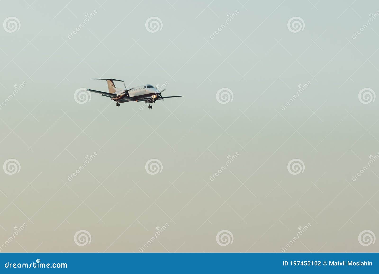 Small Propeller Plane Flying in the Sky. Plane is Landing Stock Photo ...