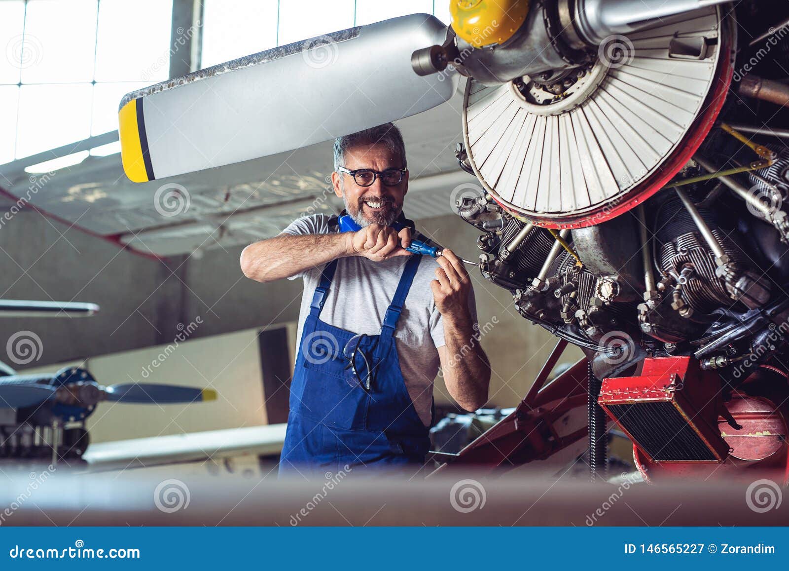 Plane Maintenance Engineer Repairing Engine Stock Image - Image of ...