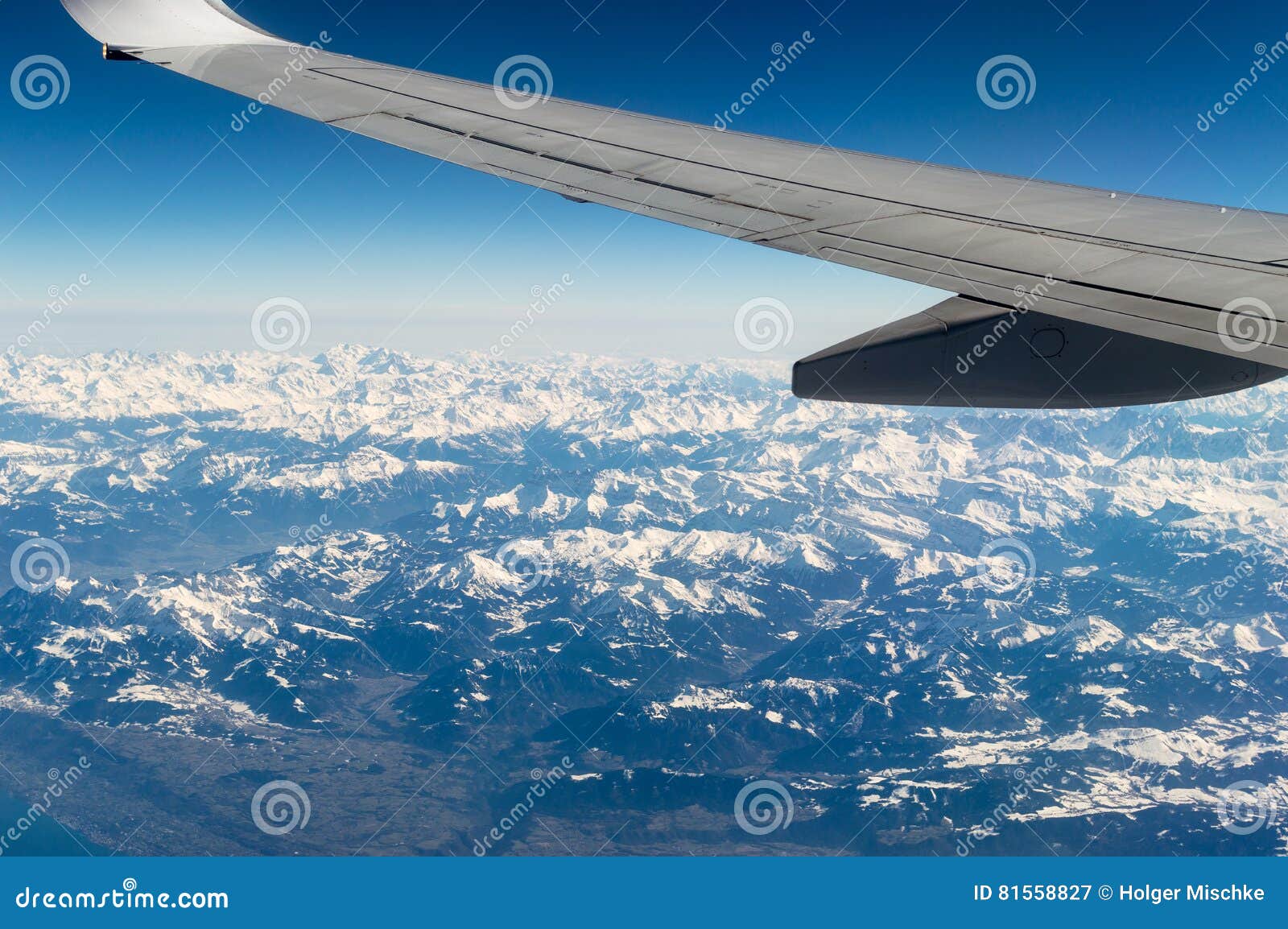 Plane over the alps stock image. Image of horizon, flight - 81558827