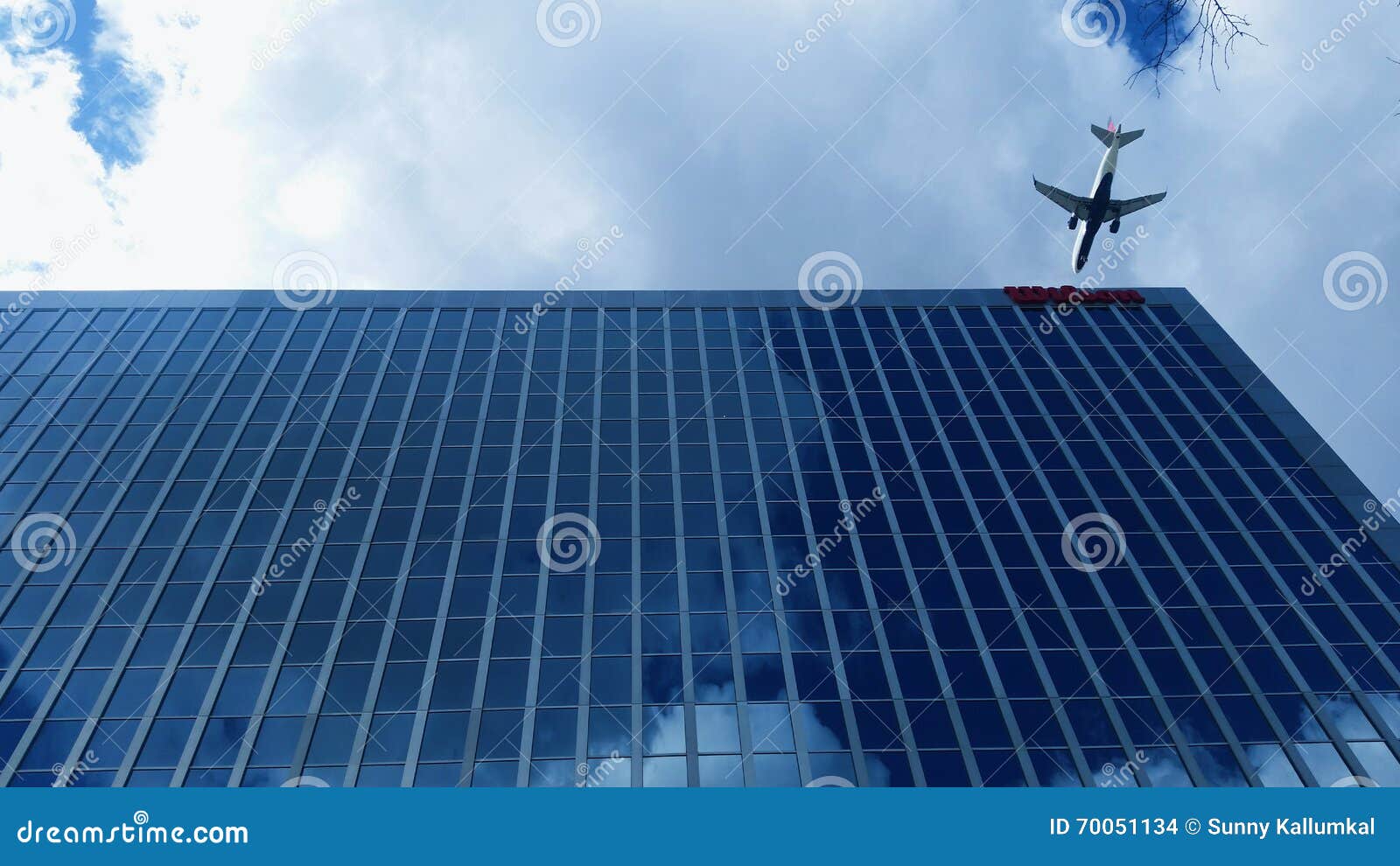 Plane Over Building editorial stock image. Image of mirrored - 70051134