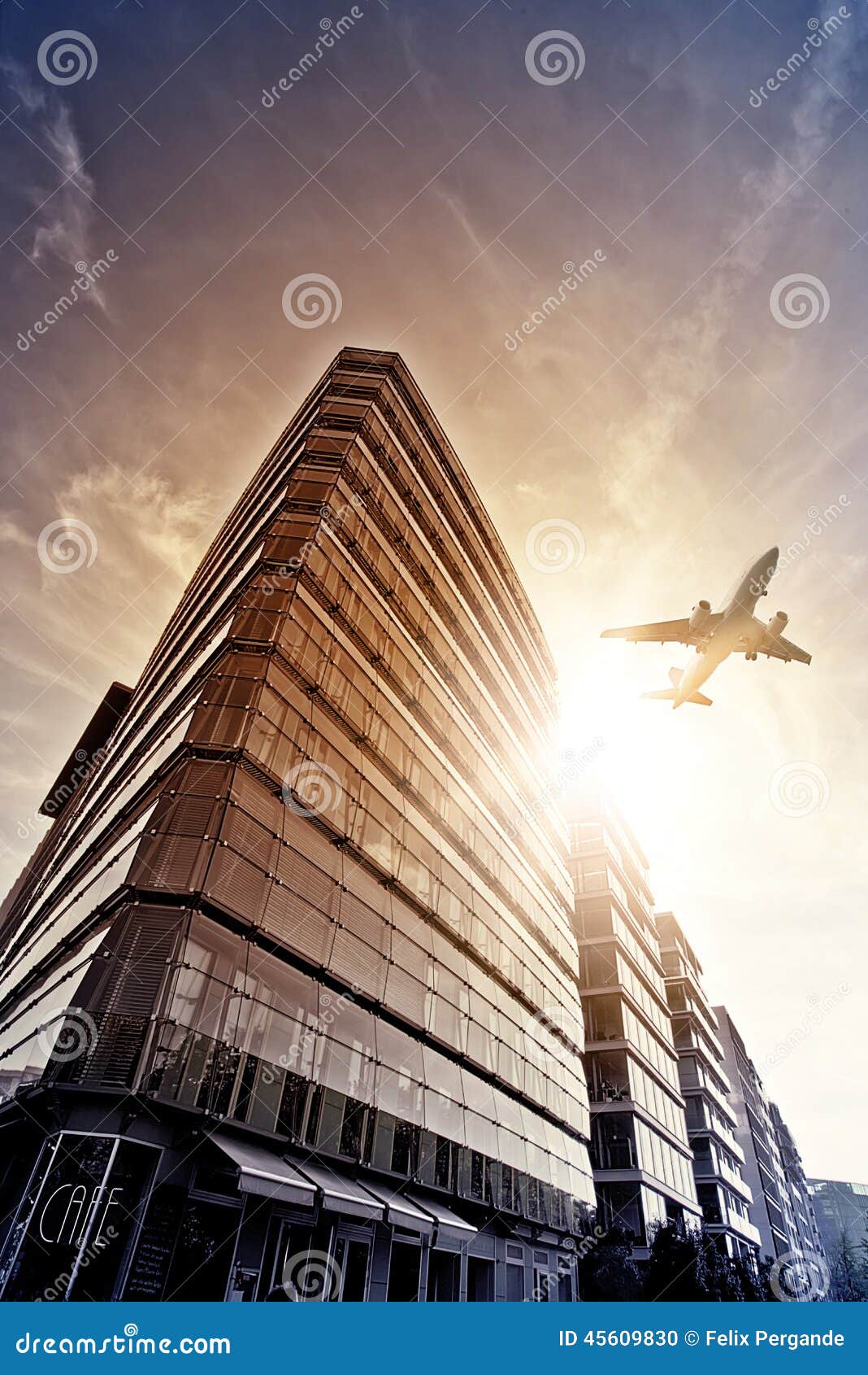 Plane over office complex stock photo. Image of modern - 45609830