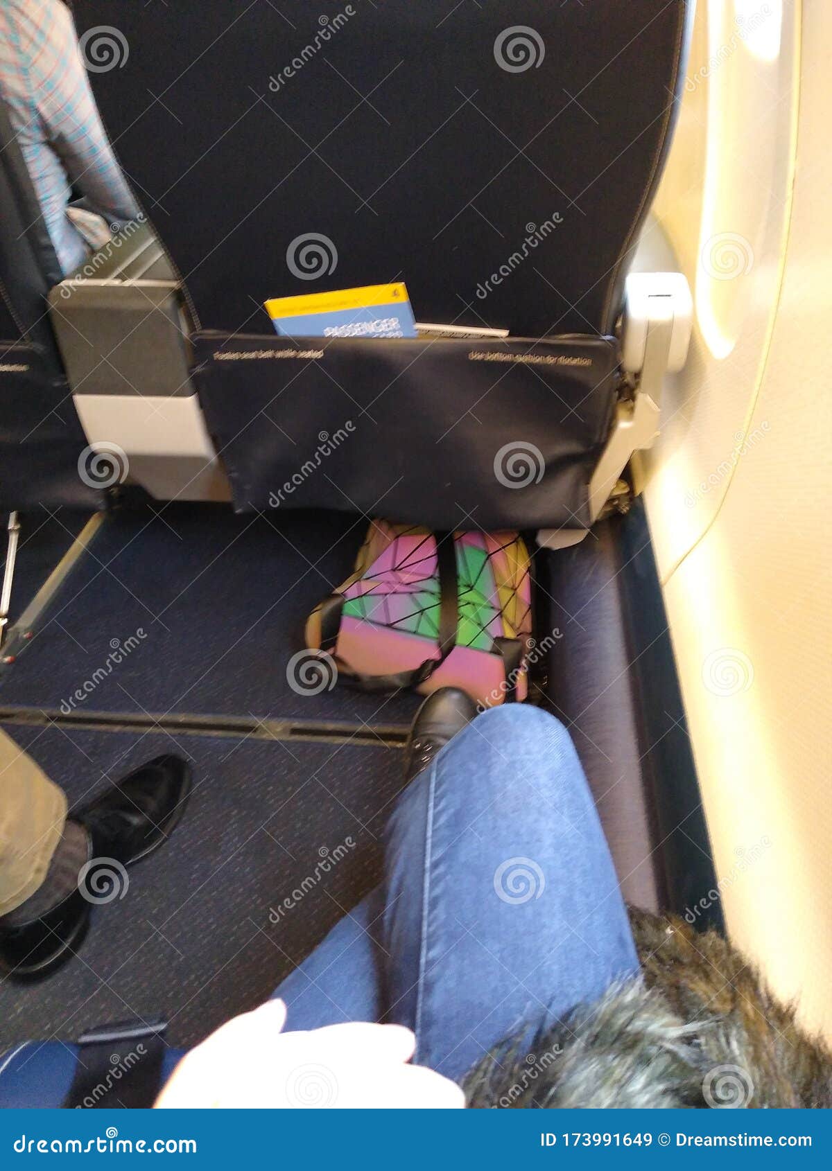 On a plane stock image. Image of airplane, plane, legs - 173991649
