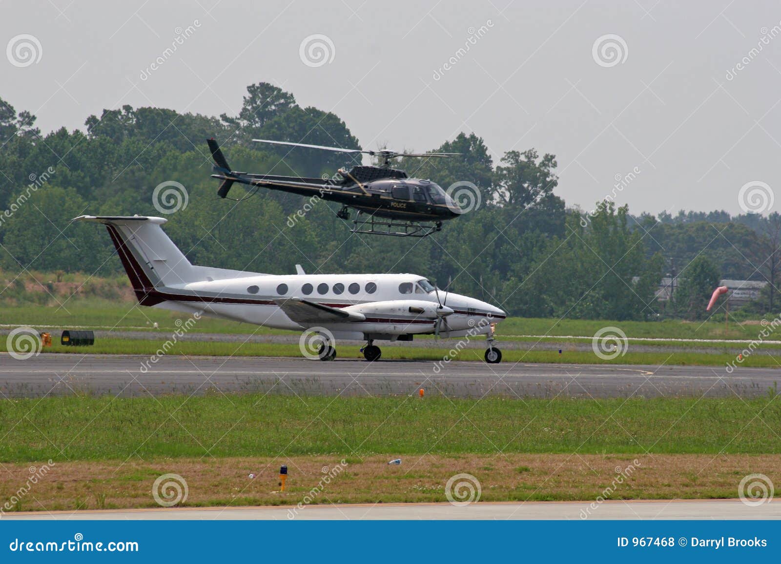 Plane and Police Chopper stock photo. Image of propeller - 967468